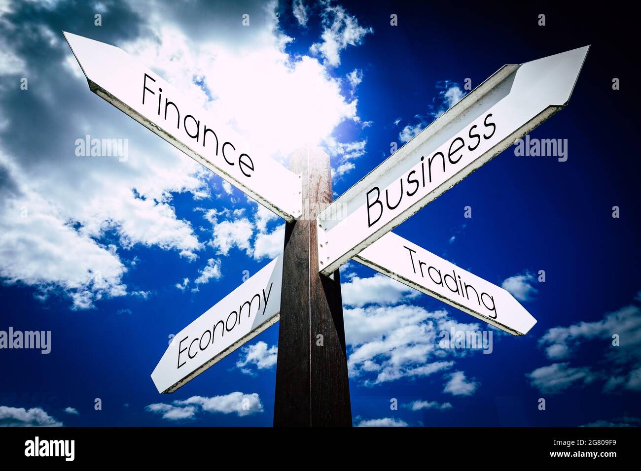 Finance, business, economy, trading concept - signpost with four arrows ...