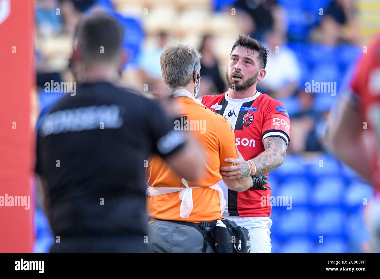 Oliver Roberts (15) of Salford Red Devils receives treatment on the ...