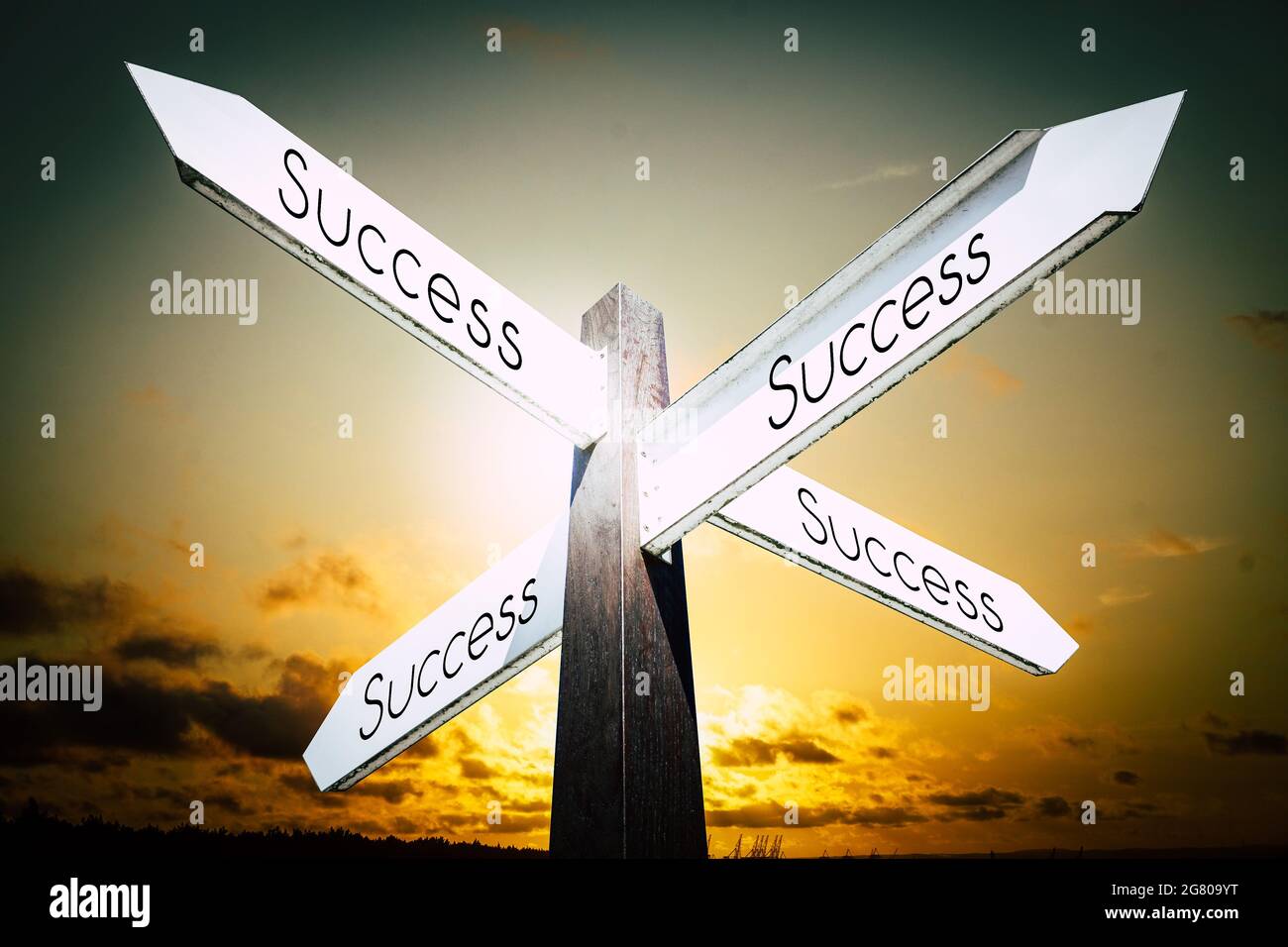 Success concept - signpost with four arrows Stock Photo - Alamy