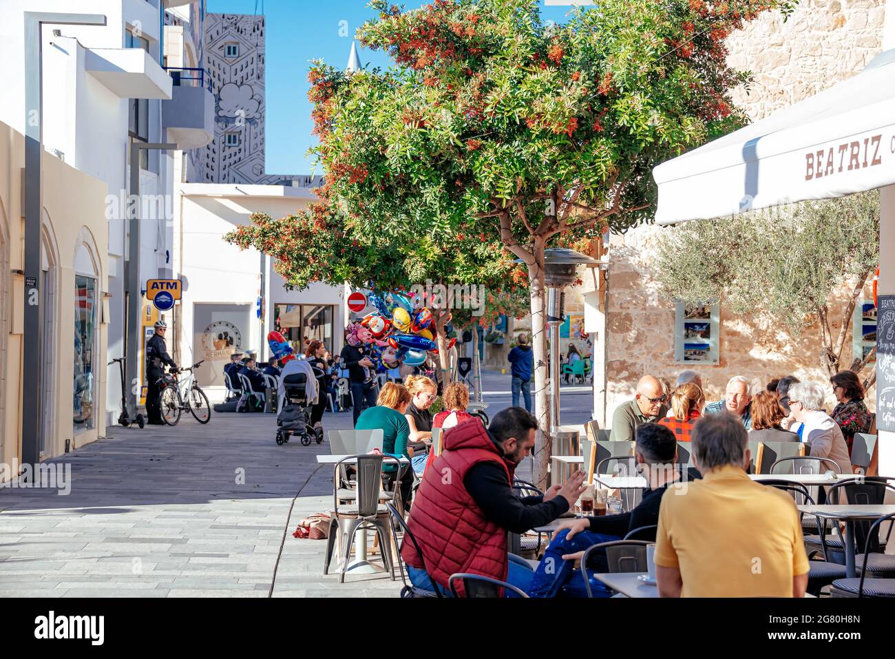 Paphos, Cyprus - December 21, 2019: People in outdoor cafe in Old Town ...