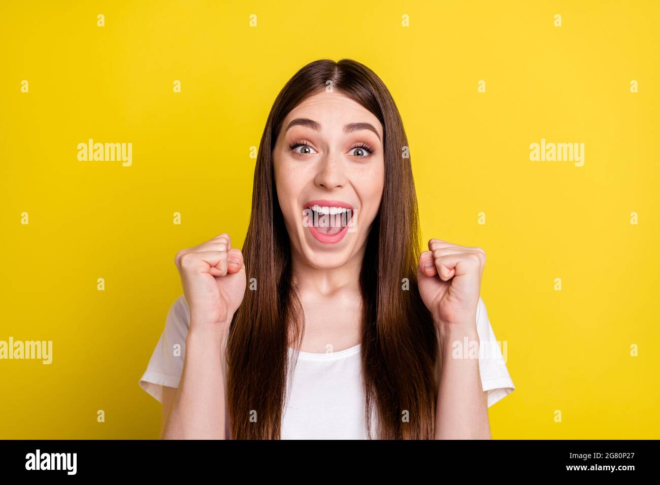Portrait of attractive cheerful girl having fun screaming celebrating ...