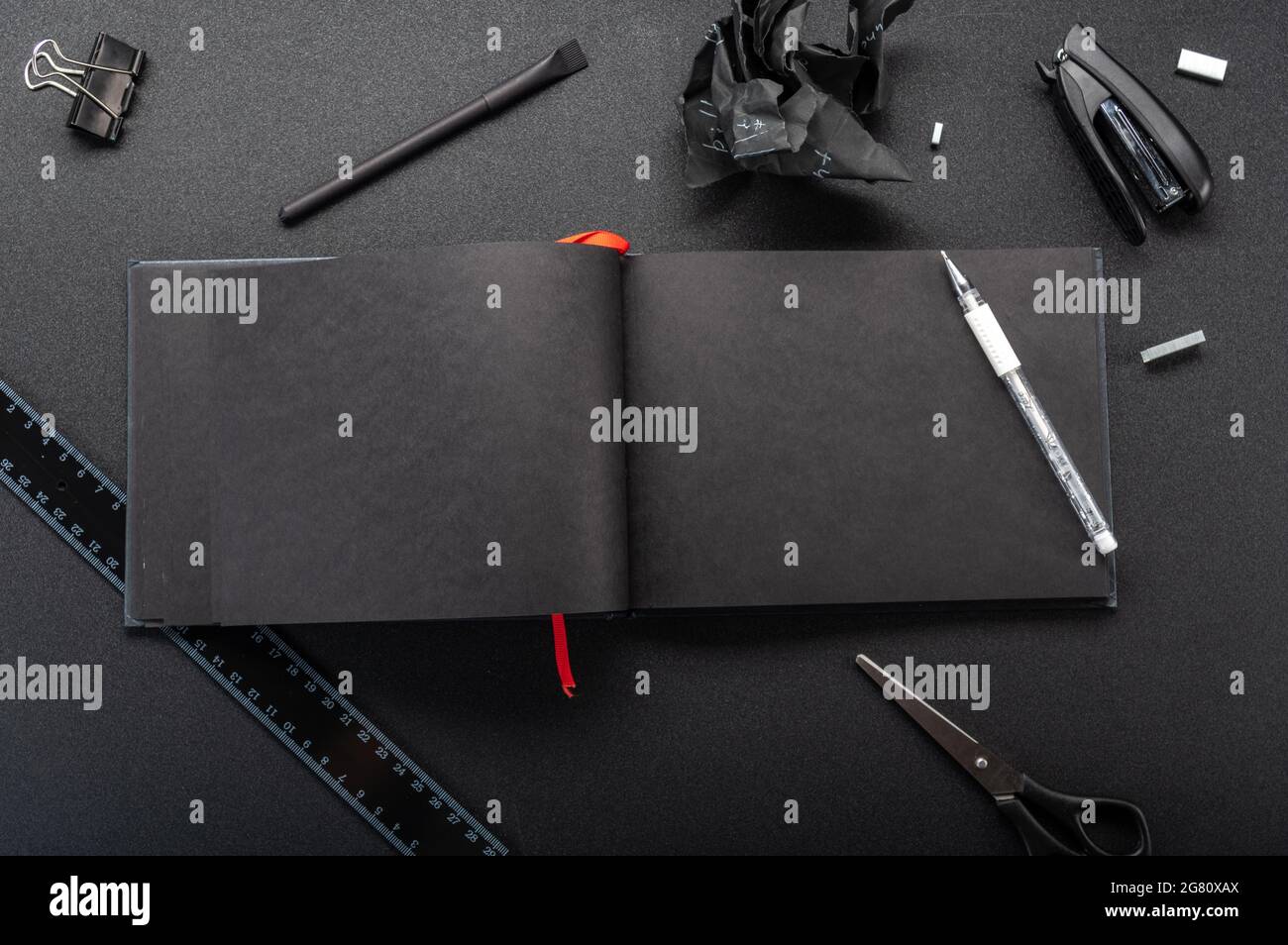 Opened black notebook. Opened journal with no entries. Place to write ...