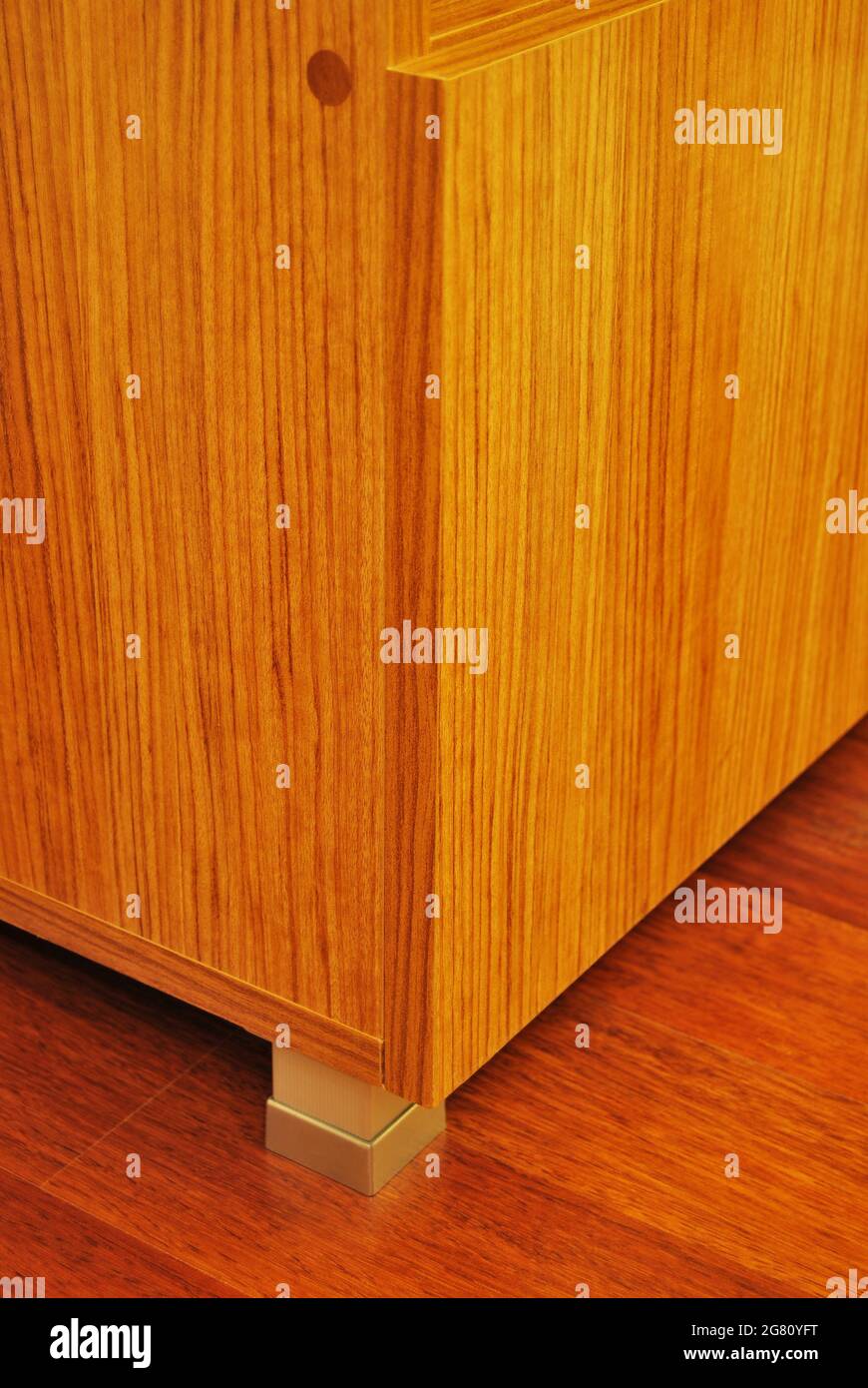 Walnut cabinet and corner detail on mahogany parquet in a luxury house ...