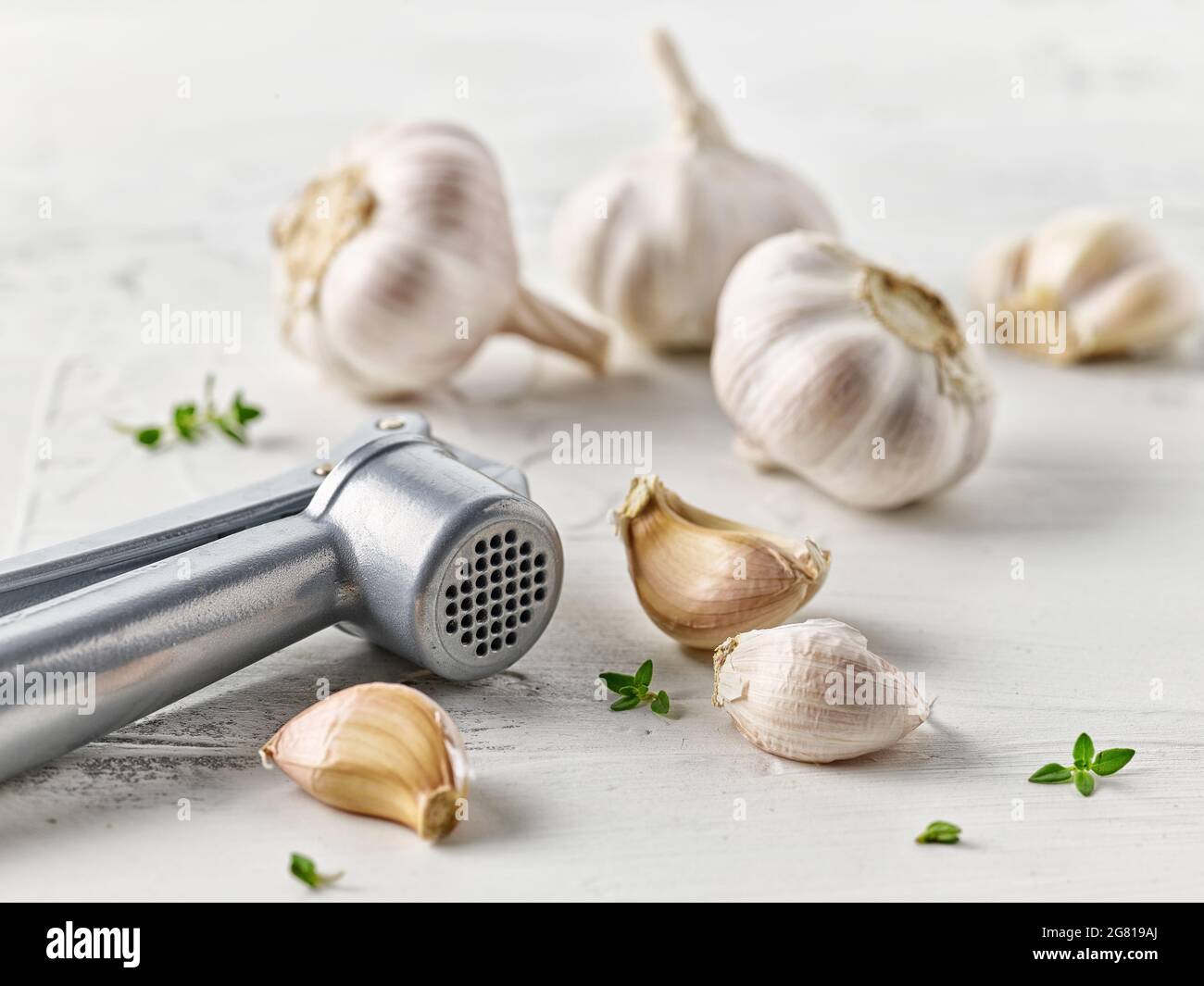 composition of garlic and spices on white kitchen table Stock Photo - Alamy