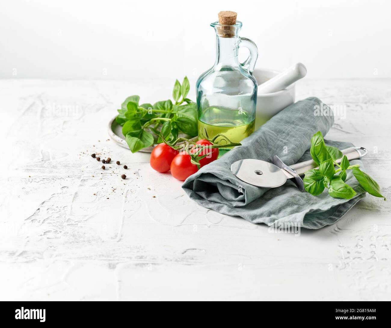 composition of various food ingredients on white kitchen table Stock ...