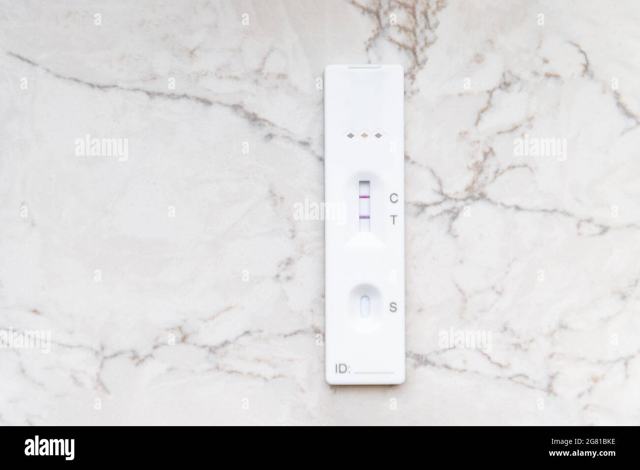 Positive rapid lateral flow coronavirus test Stock Photo - Alamy