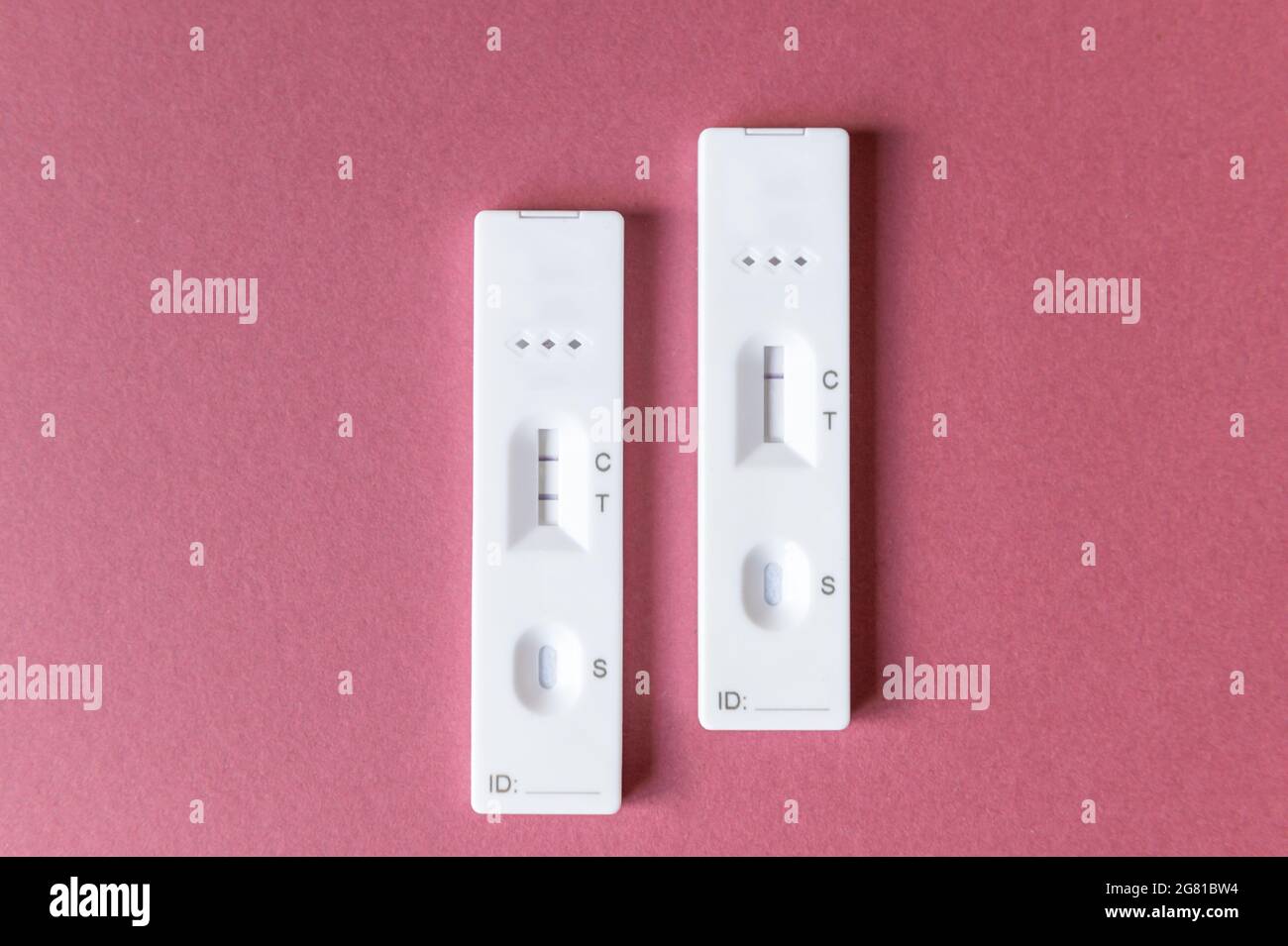 Positive and negative rapid lateral flow COVID 19 tests Stock Photo - Alamy