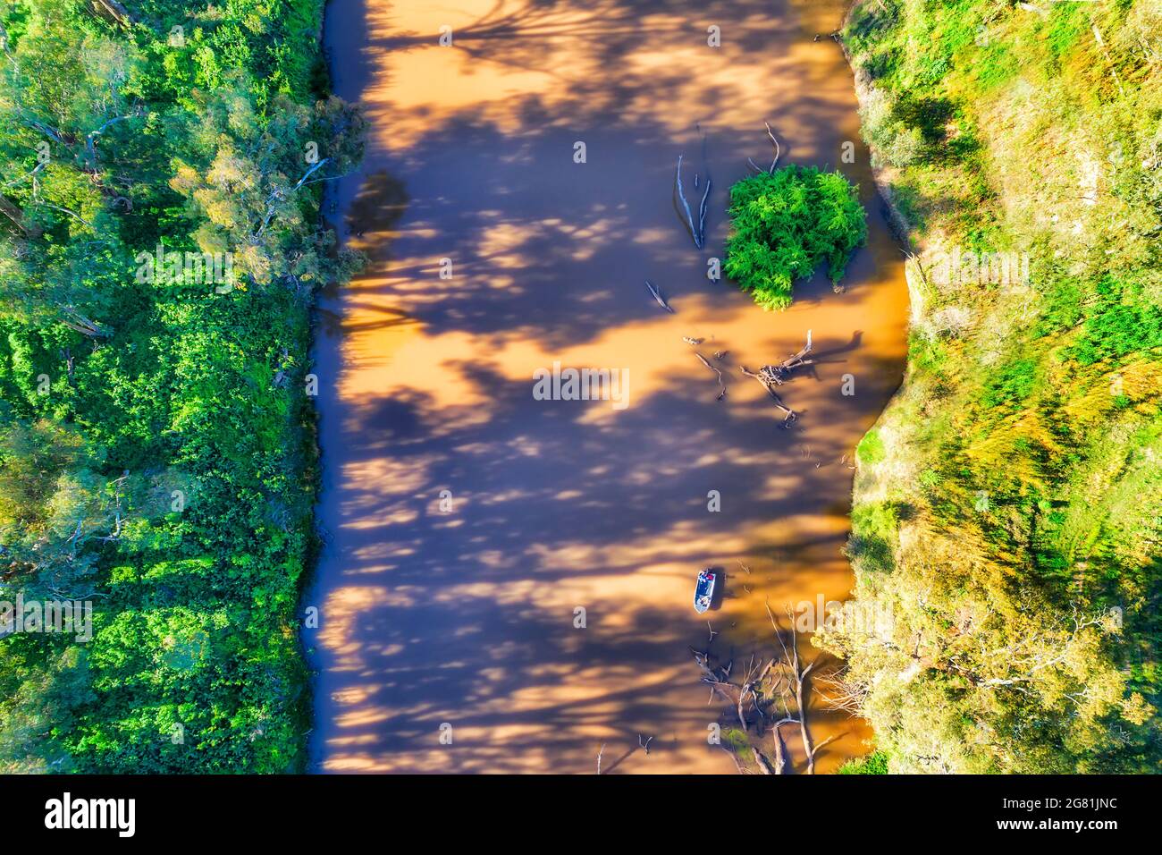 Yellow muddy waters of Macquarie river in Dubbo town – aerial 4k top ...