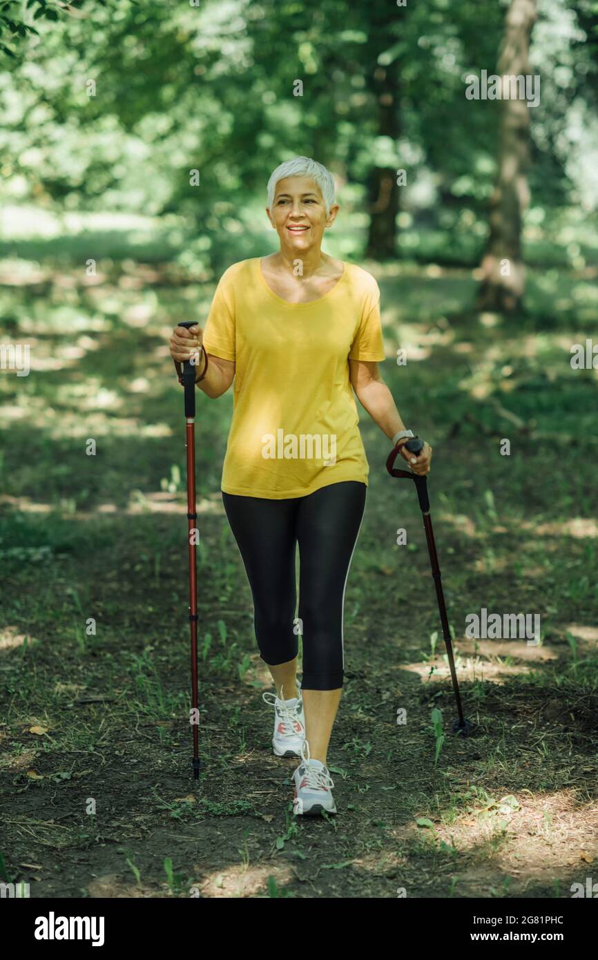 Senior woman walking Stock Photo - Alamy