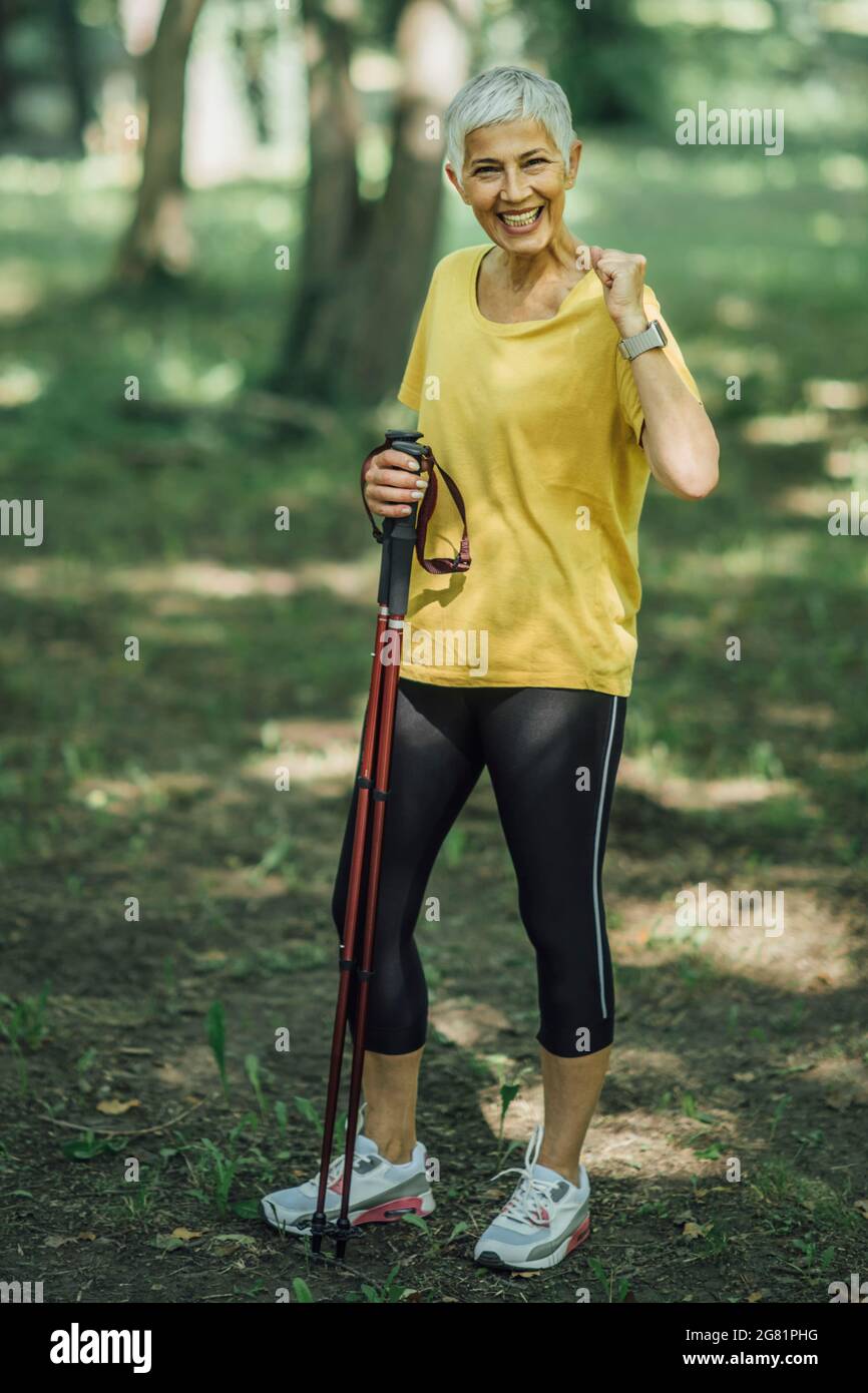 Senior woman walking Stock Photo - Alamy