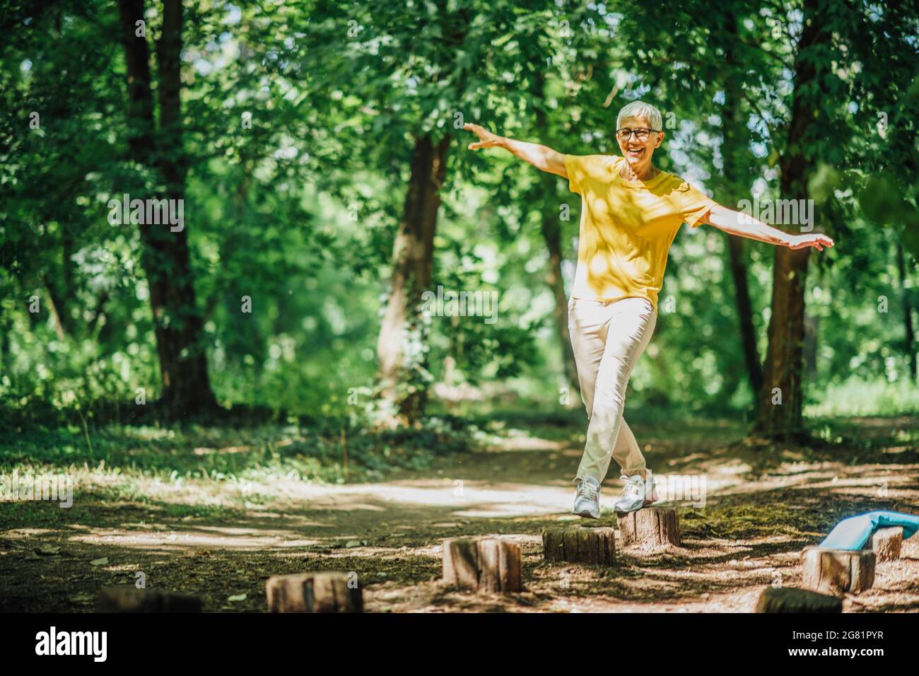 Balancing exercise outdoors Stock Photo - Alamy