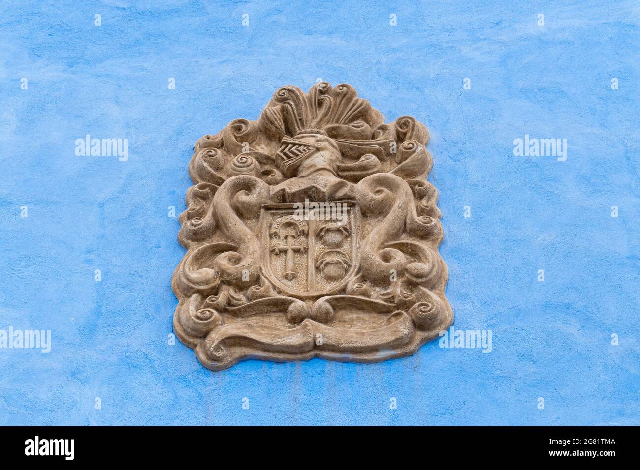 Small stone sculpture on a building wall Stock Photo - Alamy
