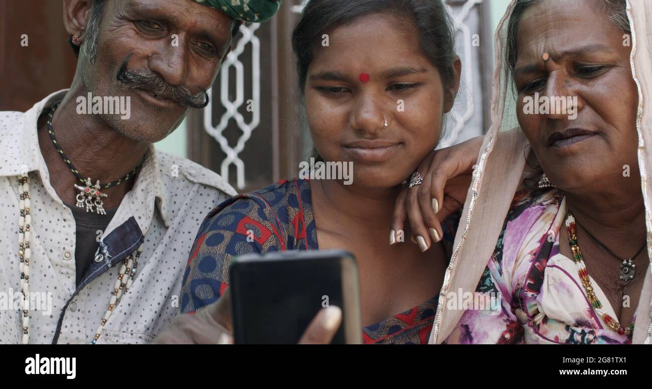 Group of South Asian people in traditional Indian clothing taking a ...