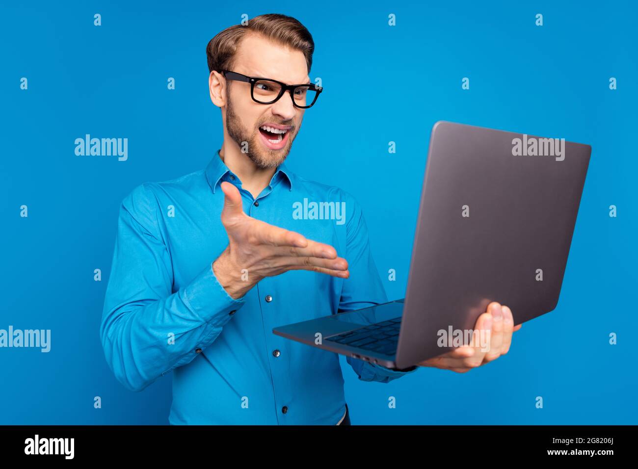 Profile side photo of young man unhappy angry mad shout problem speak ...