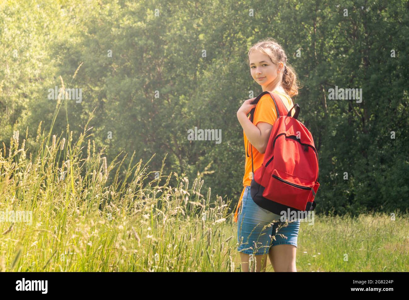 Teenager girl with backpack hi-res stock photography and images - Alamy