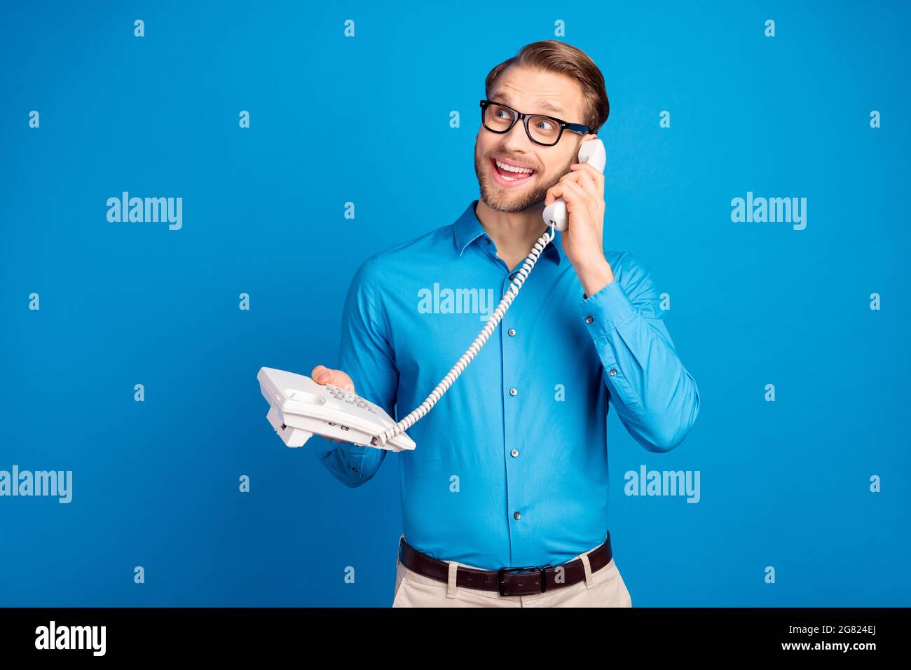 Photo of young man happy positive smile call talk speak conversation ...