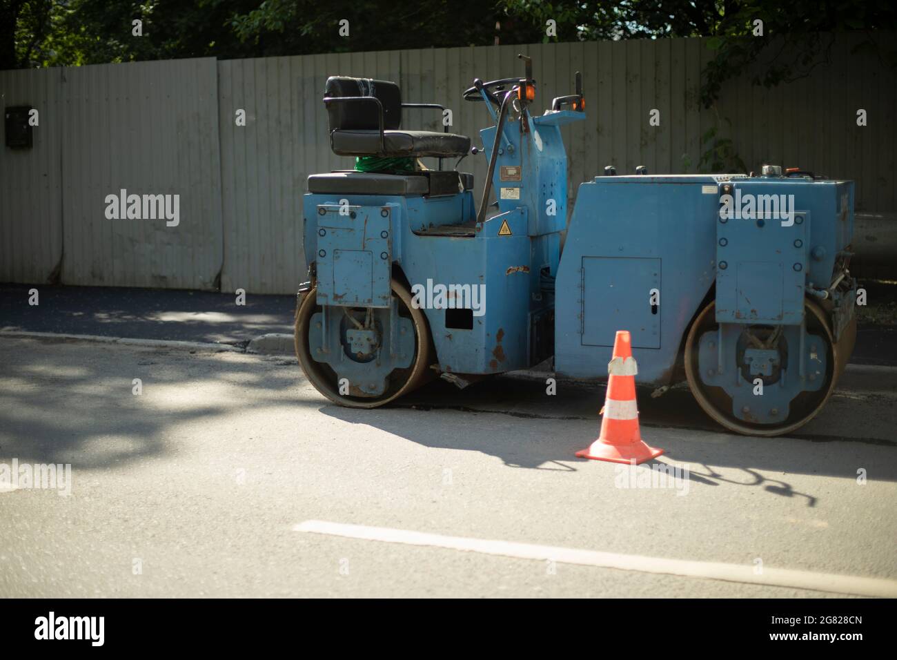 Asphalt stacker on road repairs. Construction equipment for rolling out ...