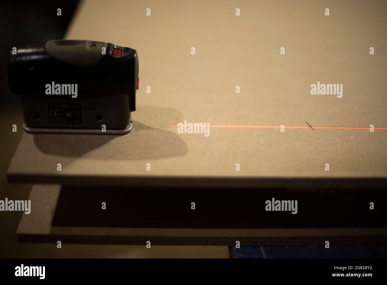 Laser level for marking material. Laser pointer. Workshop work ...