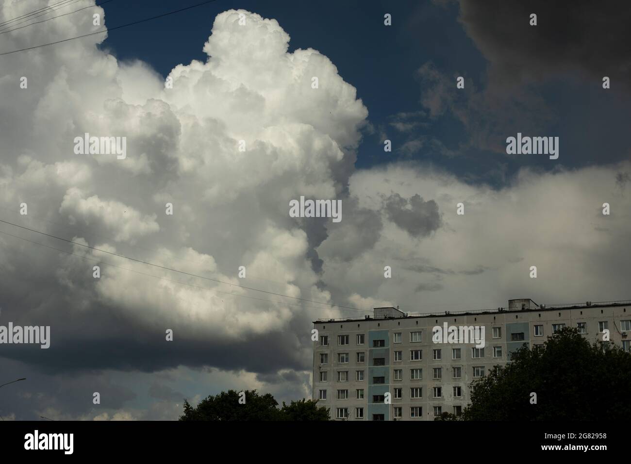 White cloud in summer. Changing weather. A storm cloud over the city ...