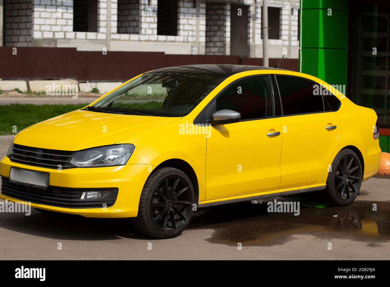 Yellow car. The car's on the street. The bright color of the vehicles ...