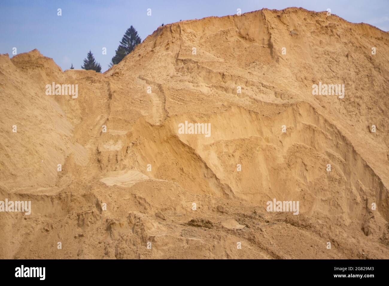 Construction sand. A mountain of sand to build. Construction site with ...