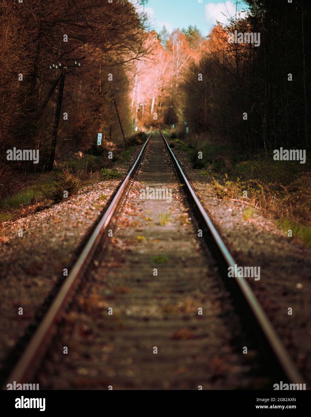 Vertical shot of railway rails in a countryside Stock Photo - Alamy