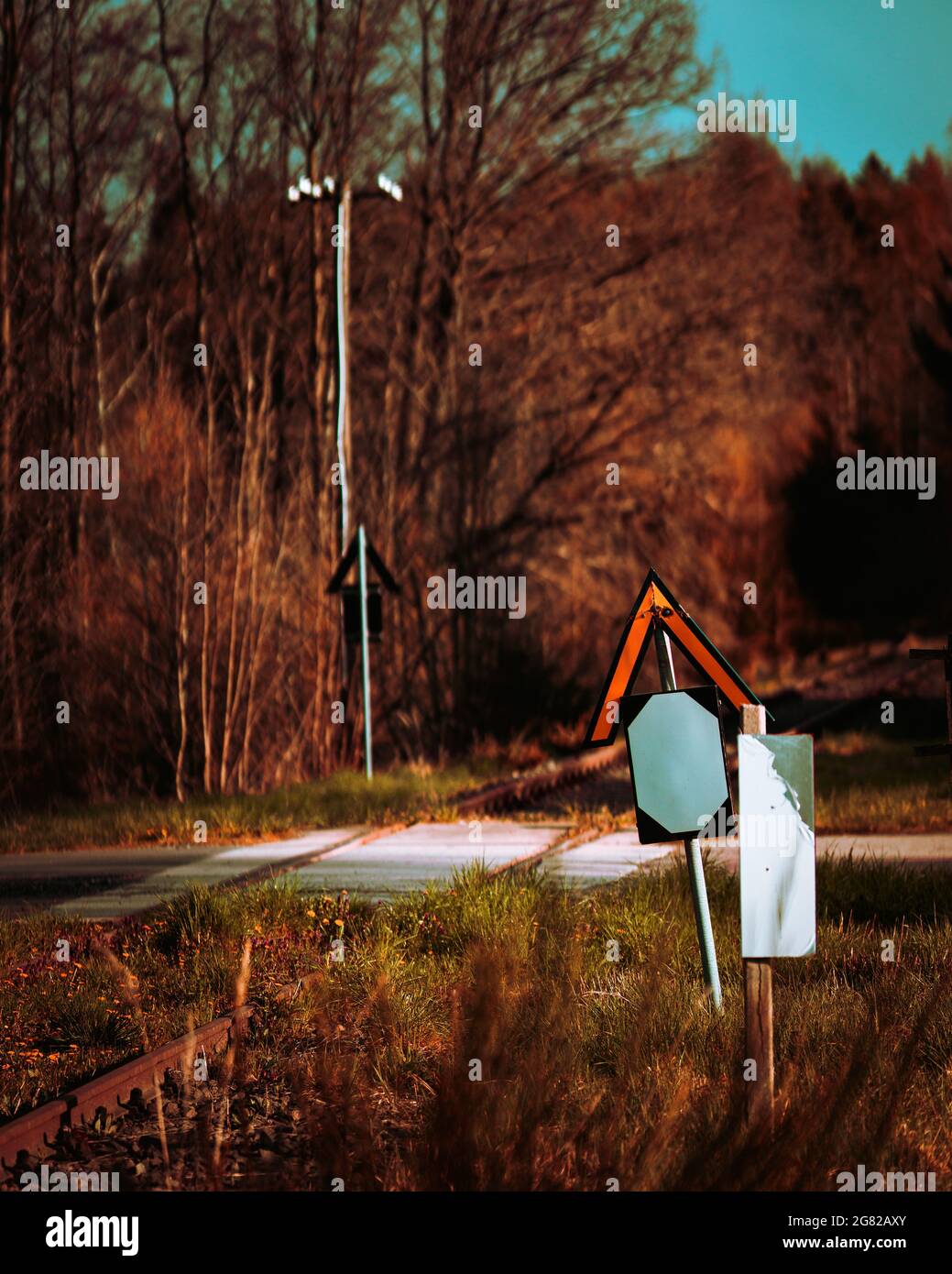 Vertical shot of railway rails and signs in a countryside Stock Photo ...