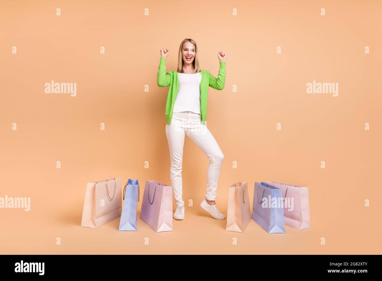Full length body size view of attractive cheerful girl celebrating new ...