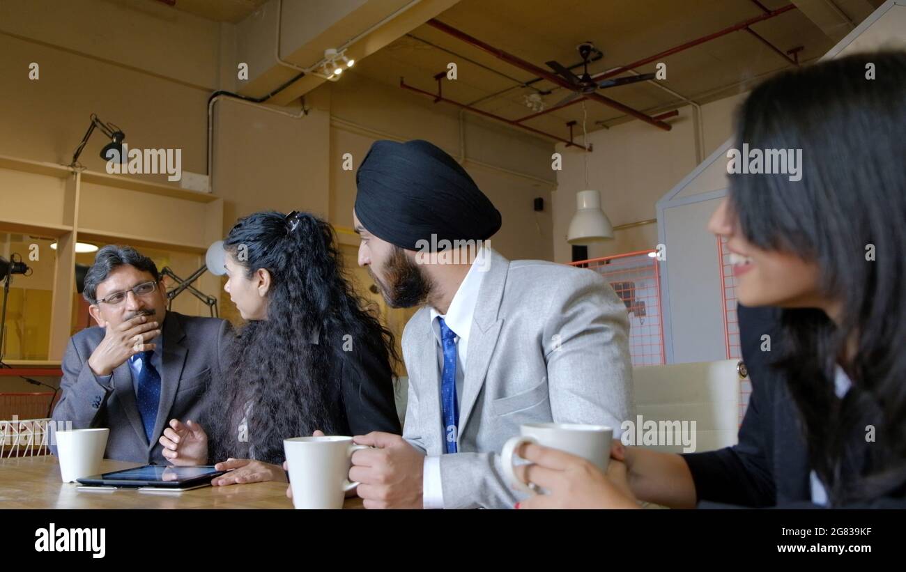 Constructive discussion between colleagues during break time in the ...