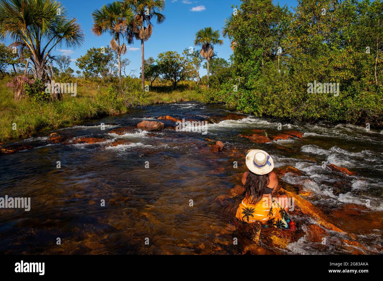 Tourist enjoying the the pure water of the beautiful Das Pratas river, near São Felix do ...