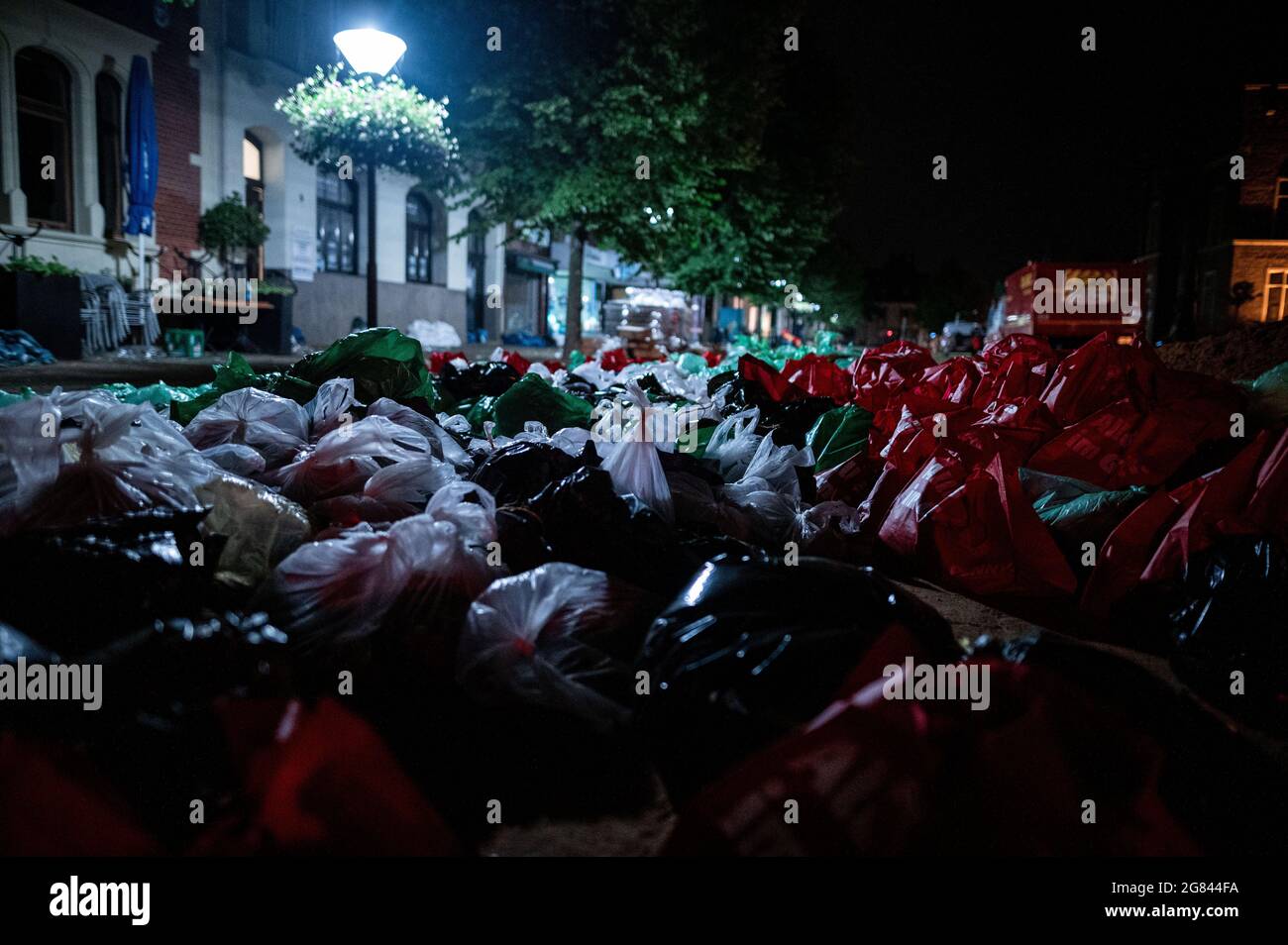 Erftstadt, Germany. 17th July, 2021. Sandbags lie stacked on the market ...