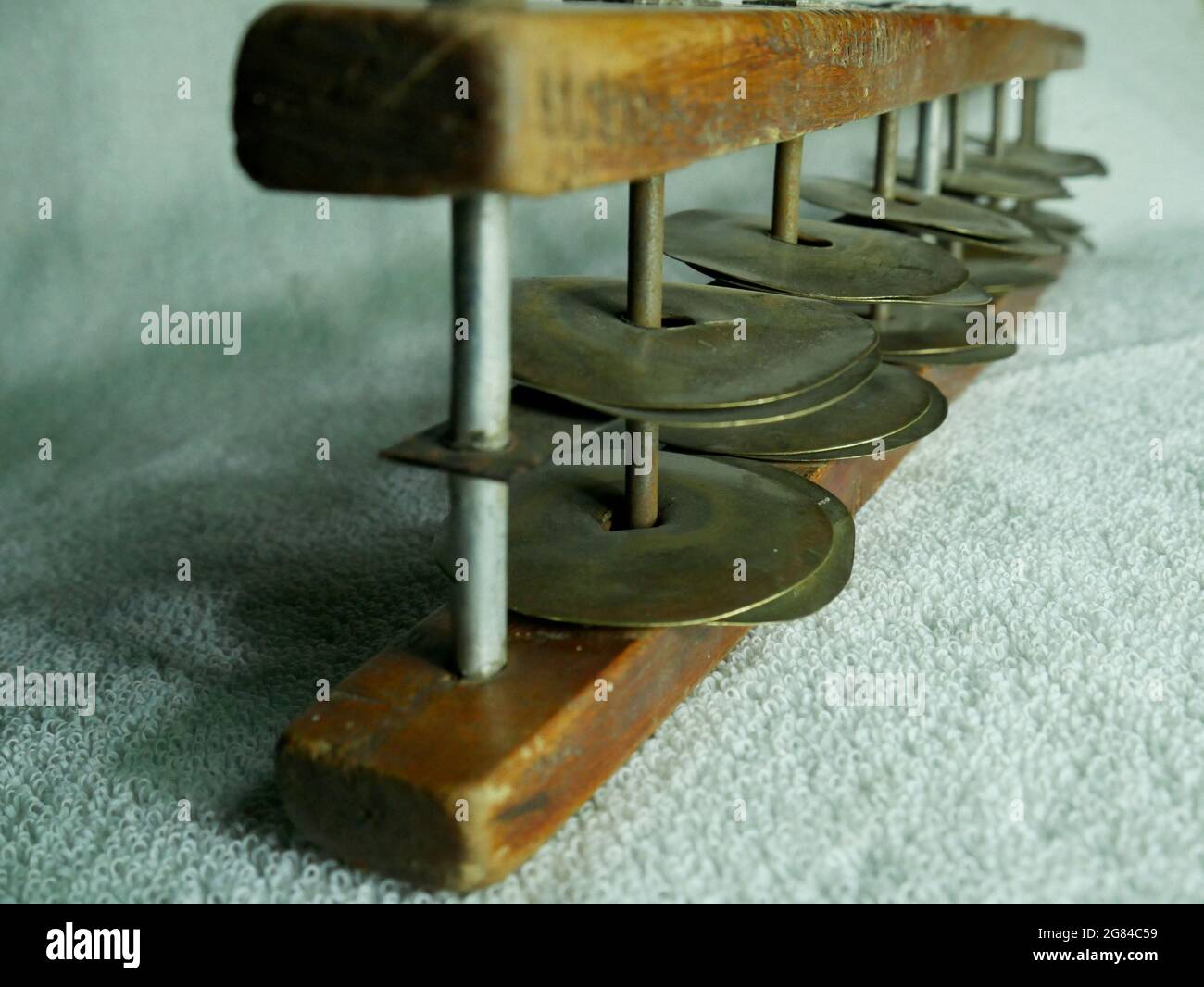 Asian Musical religious instrument brass and wooden presented at white ...