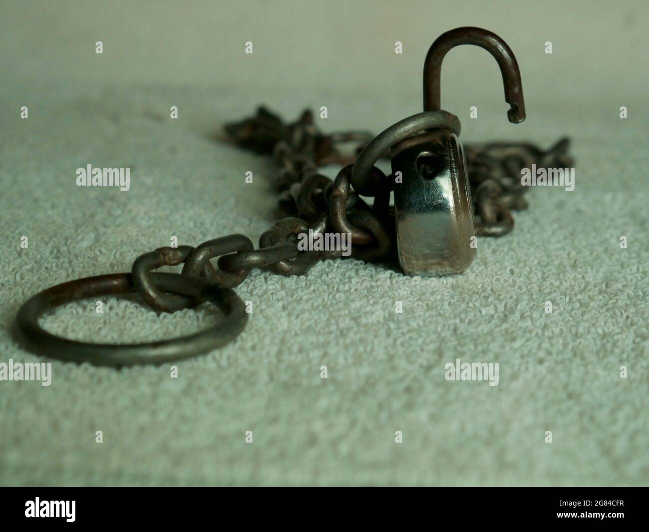 Iron chain with lock Displaying at white fabric, Industrial concept ...