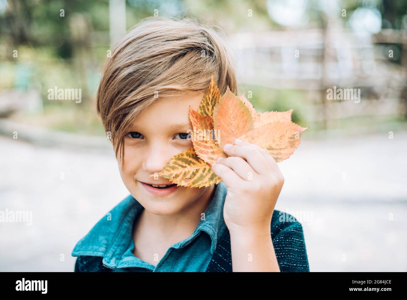 Autumn child boy with autumnal mood. Boy on a breeze in an autumn ...
