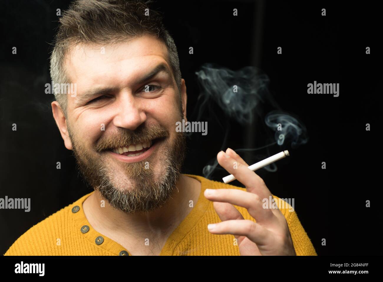 Stop smoking addiction. Bad guy addict with a syringe using drugs ...