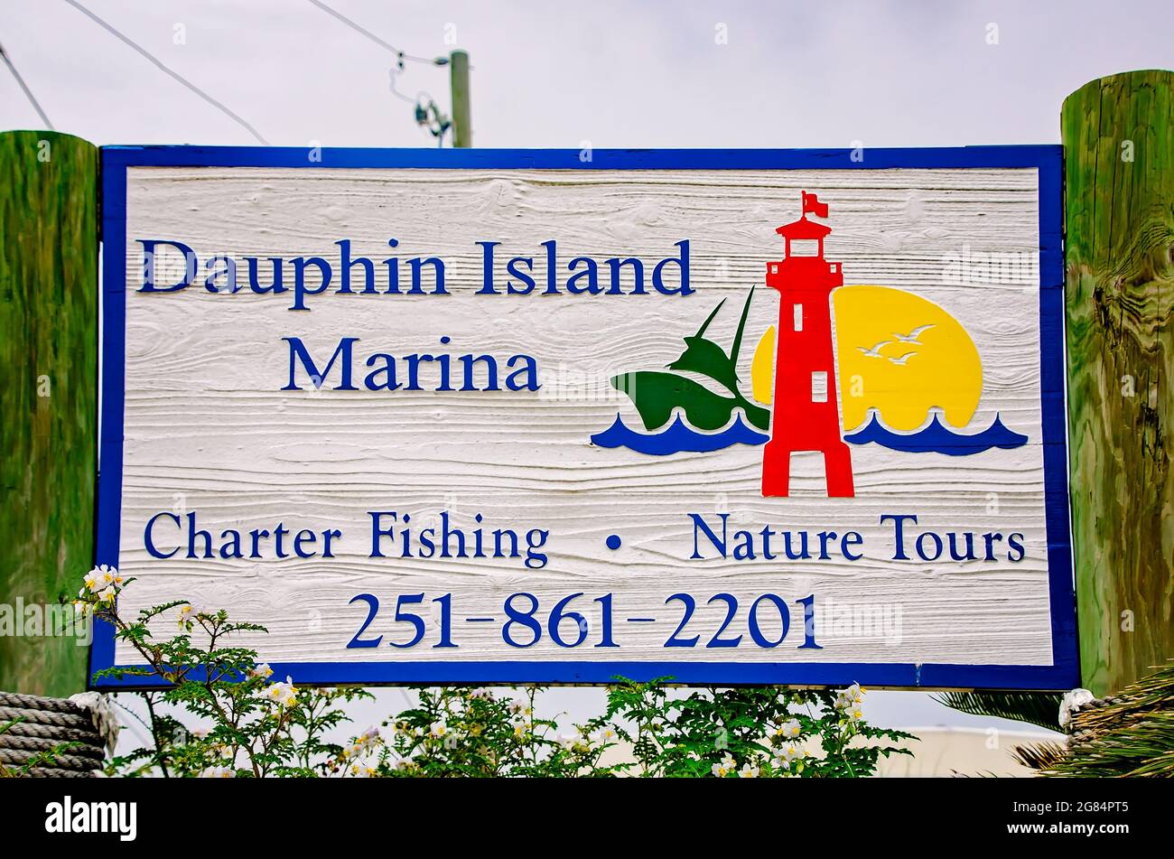 The Dauphin Island Marina sign is pictured at the entrance to the ...