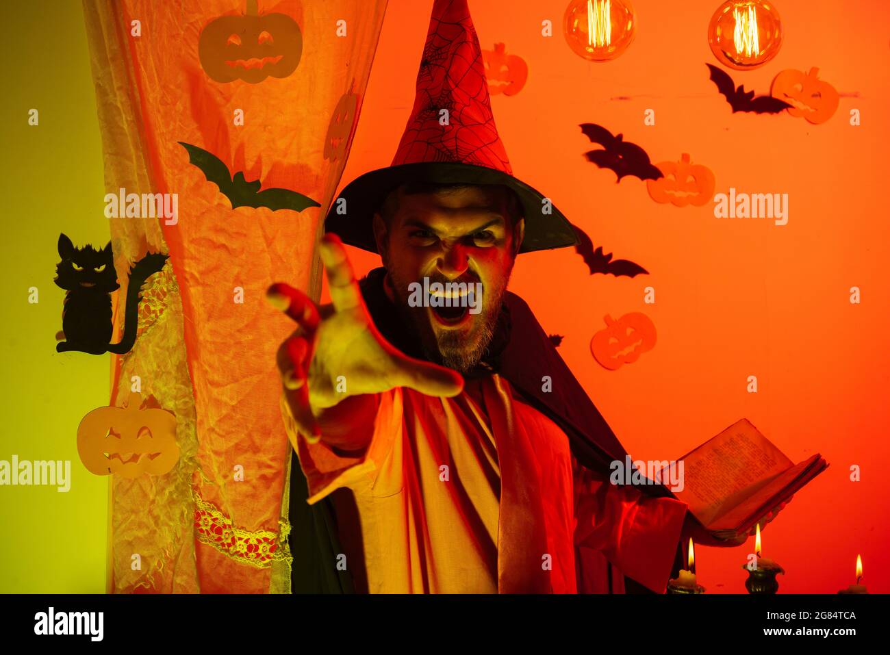 Man Horror faces. Scary man reading a magic book with spells. Father on ...