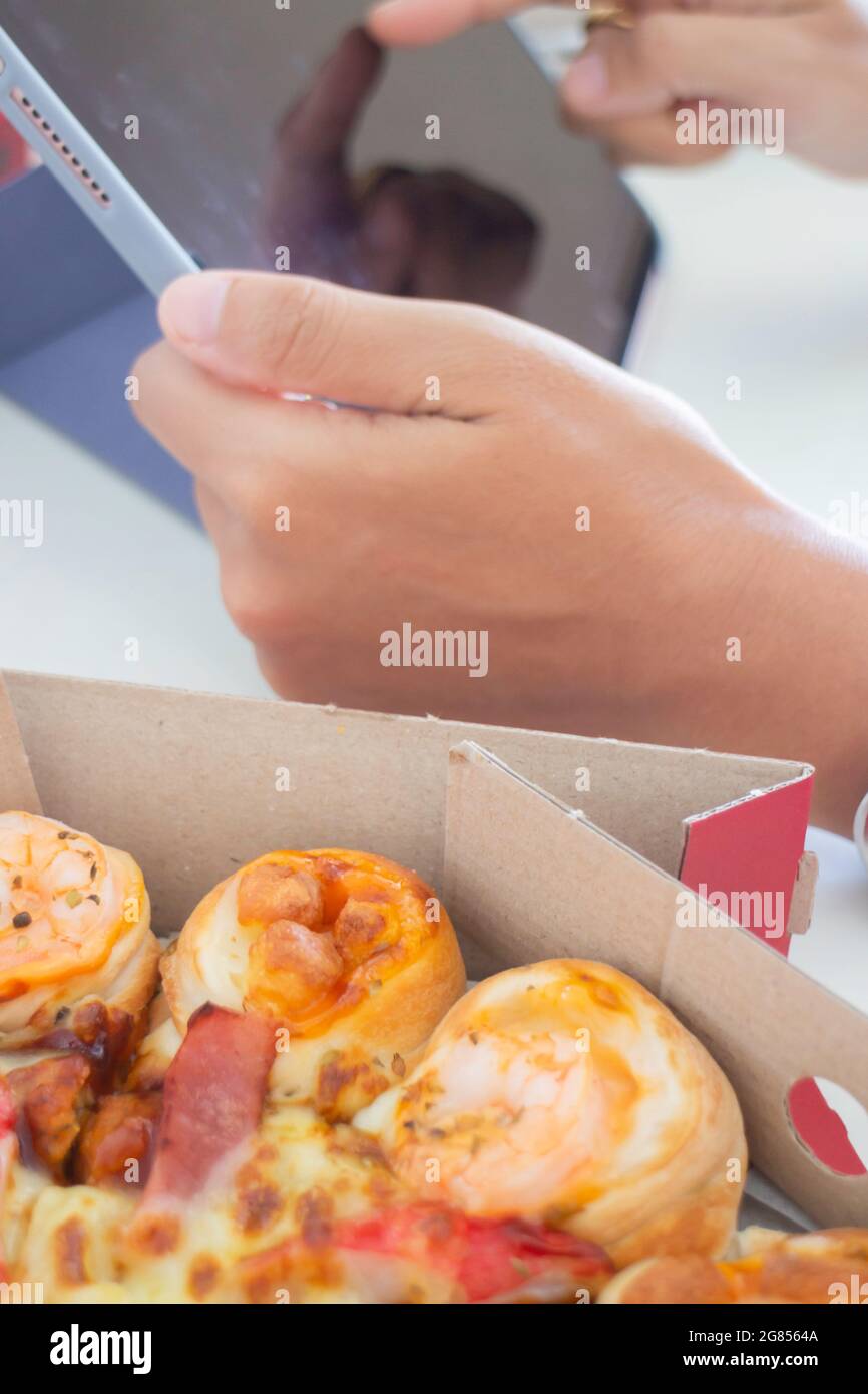 Pizza fast food in the office, stock photo Stock Photo - Alamy