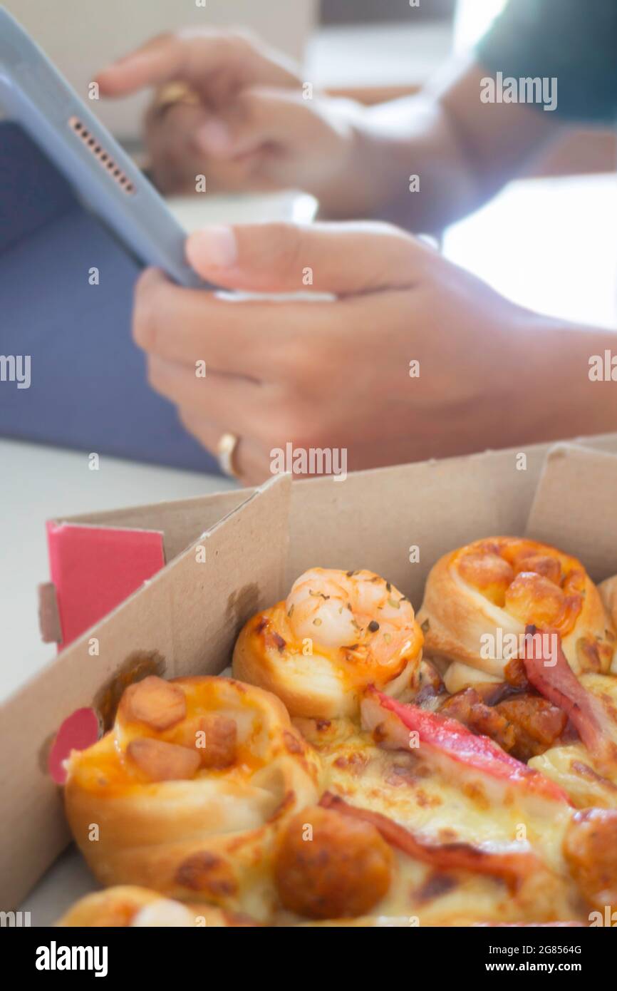 Pizza fast food in the office, stock photo Stock Photo - Alamy