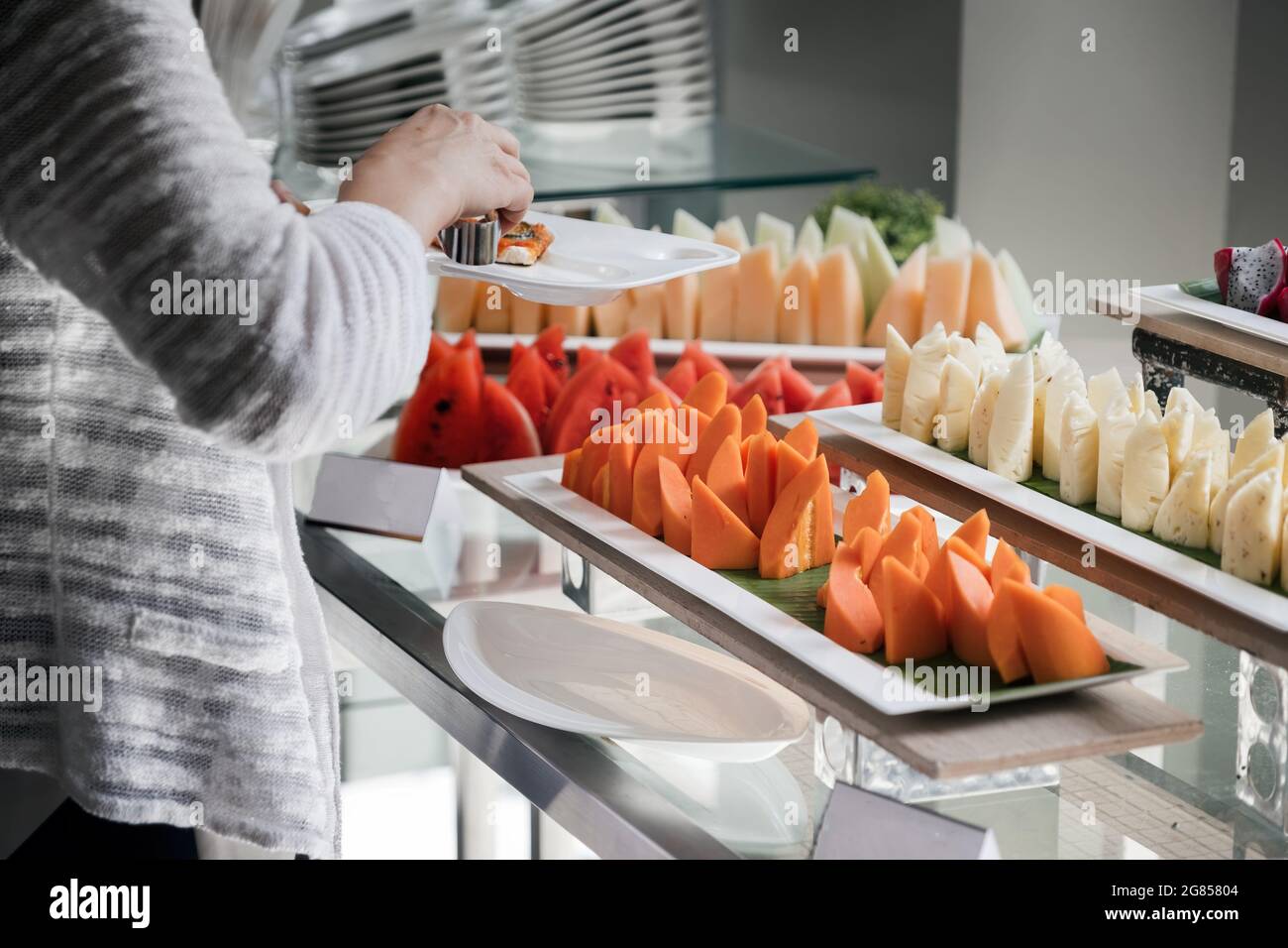 a people pickup some fruit at food conner for lunch Stock Photo - Alamy