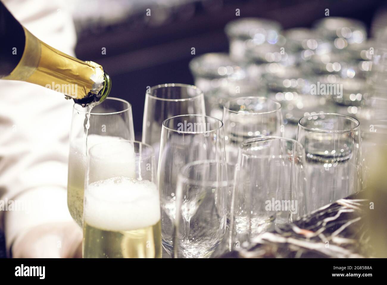 Pouring wine many glasses hi-res stock photography and images - Alamy