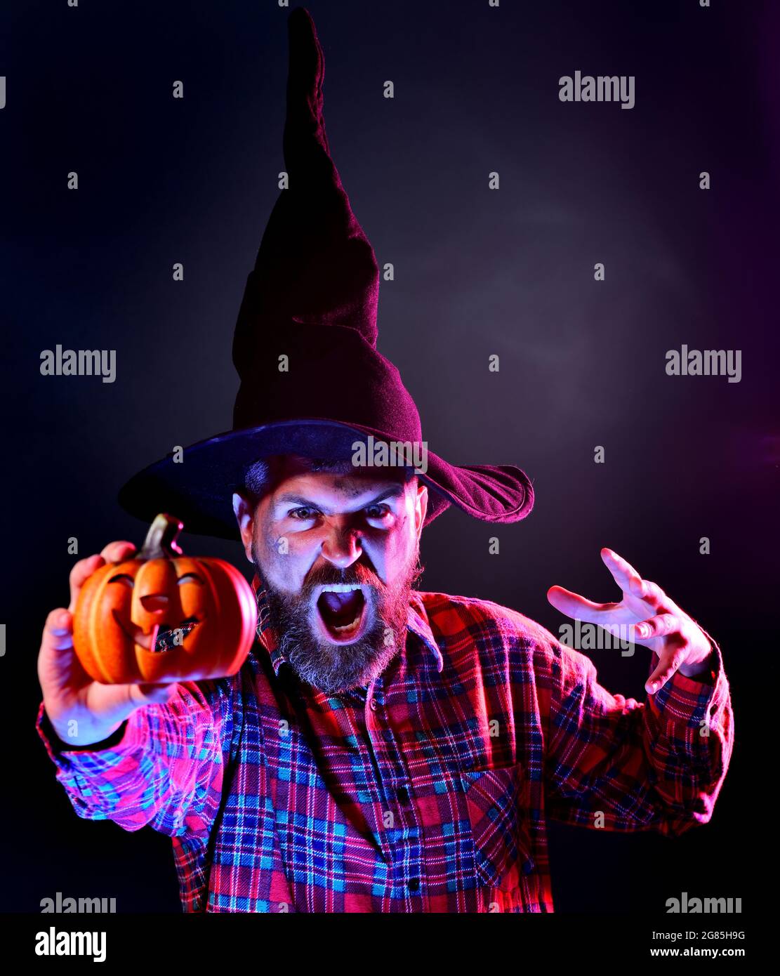 Halloween man with scary face on dark background. Halloween, holidays ...
