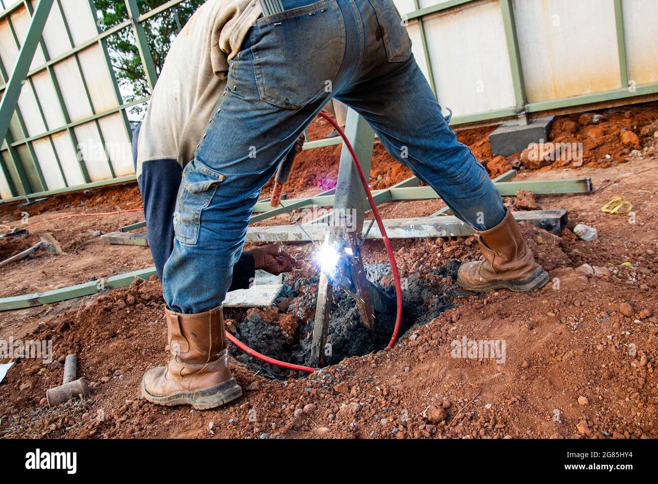 A worker doing welding on construction site Stock Photo - Alamy