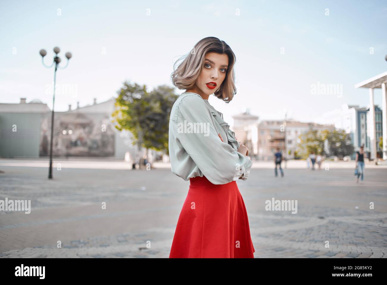 blonde in red skirt outdoors walking outdoors posing Stock Photo - Alamy