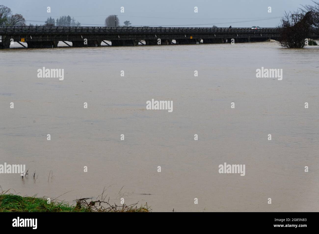 The Motueka River is fast approaching the bottom of the bridge as it ...