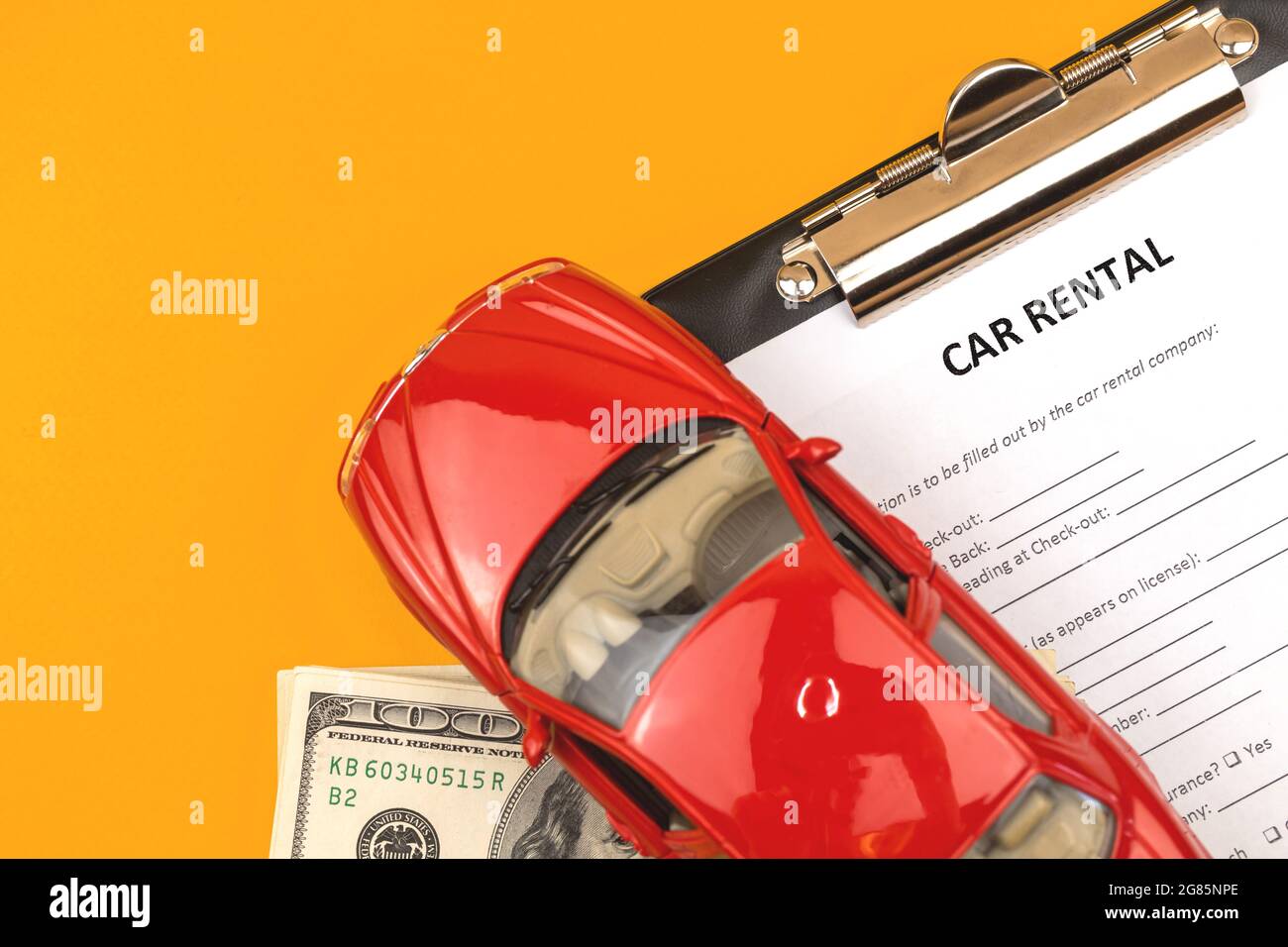 Car rental lease contract form. Office desk with clipboard and toy car ...