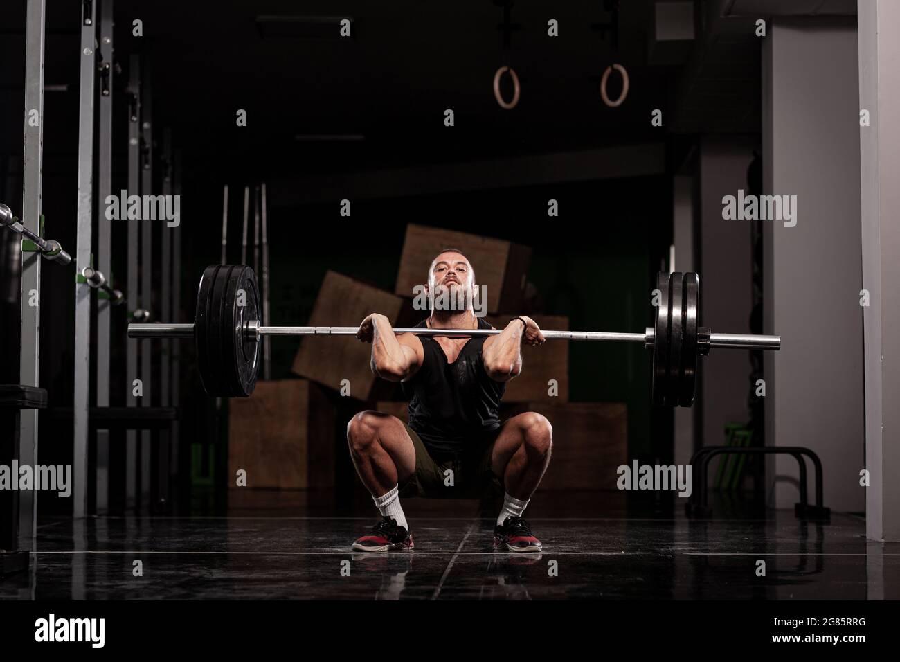 Muscular athlete lifting very heavy barbell Stock Photo - Alamy