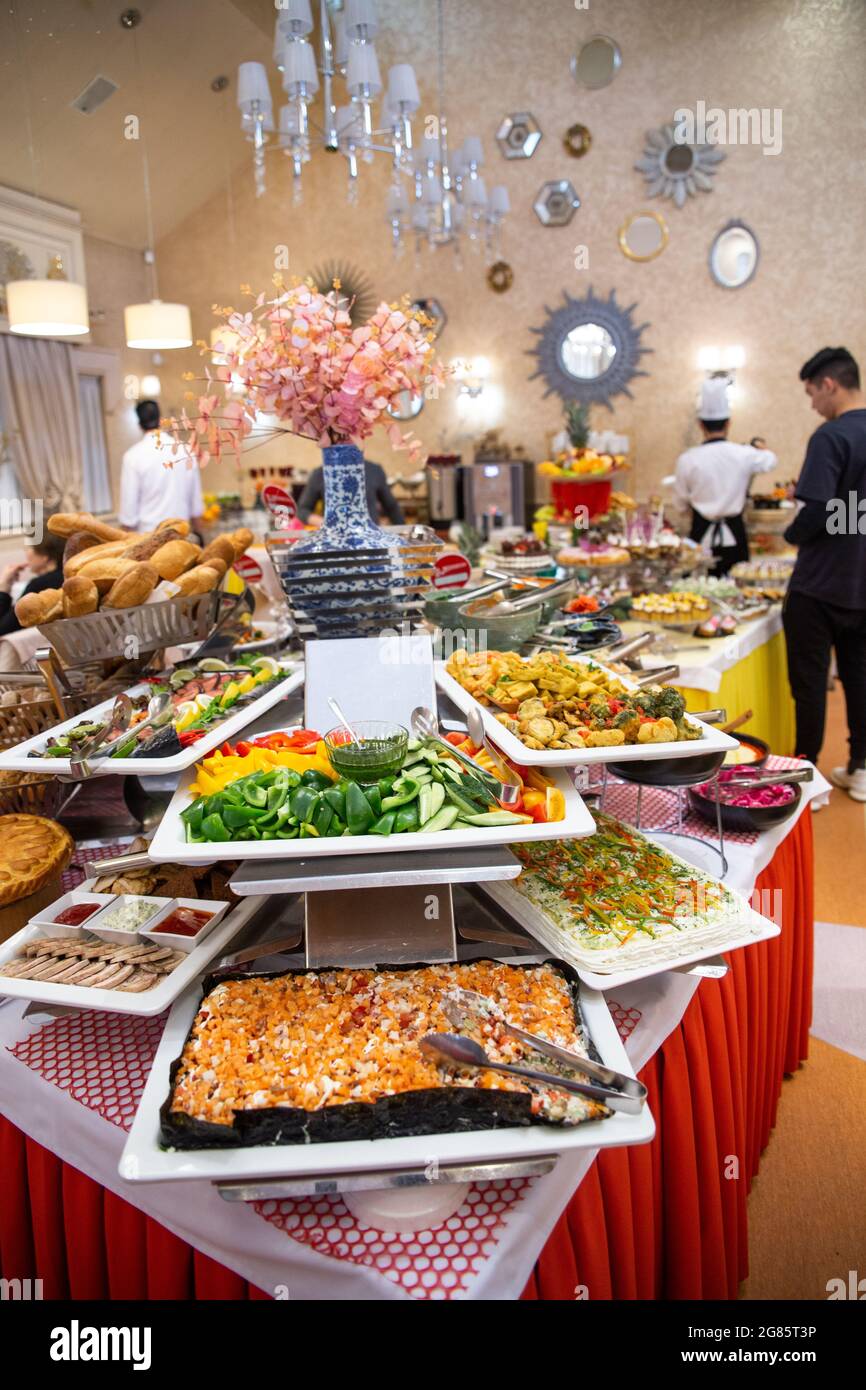 Buffet table in the hotel with various dishes Stock Photo - Alamy
