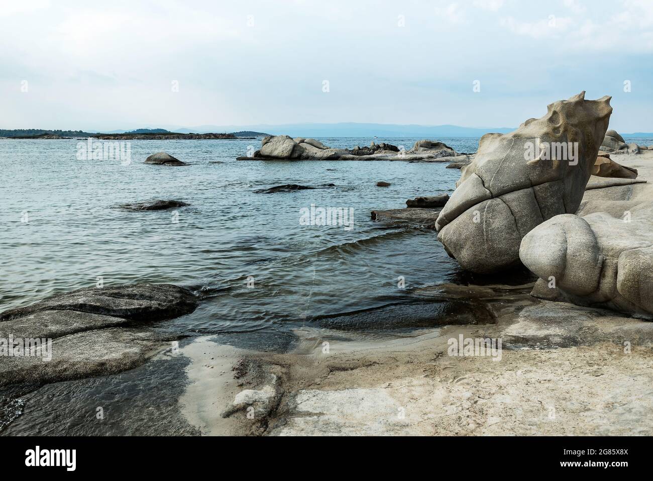 Seascape of rocky beach with beautiful rocks formations. Sea waves ...