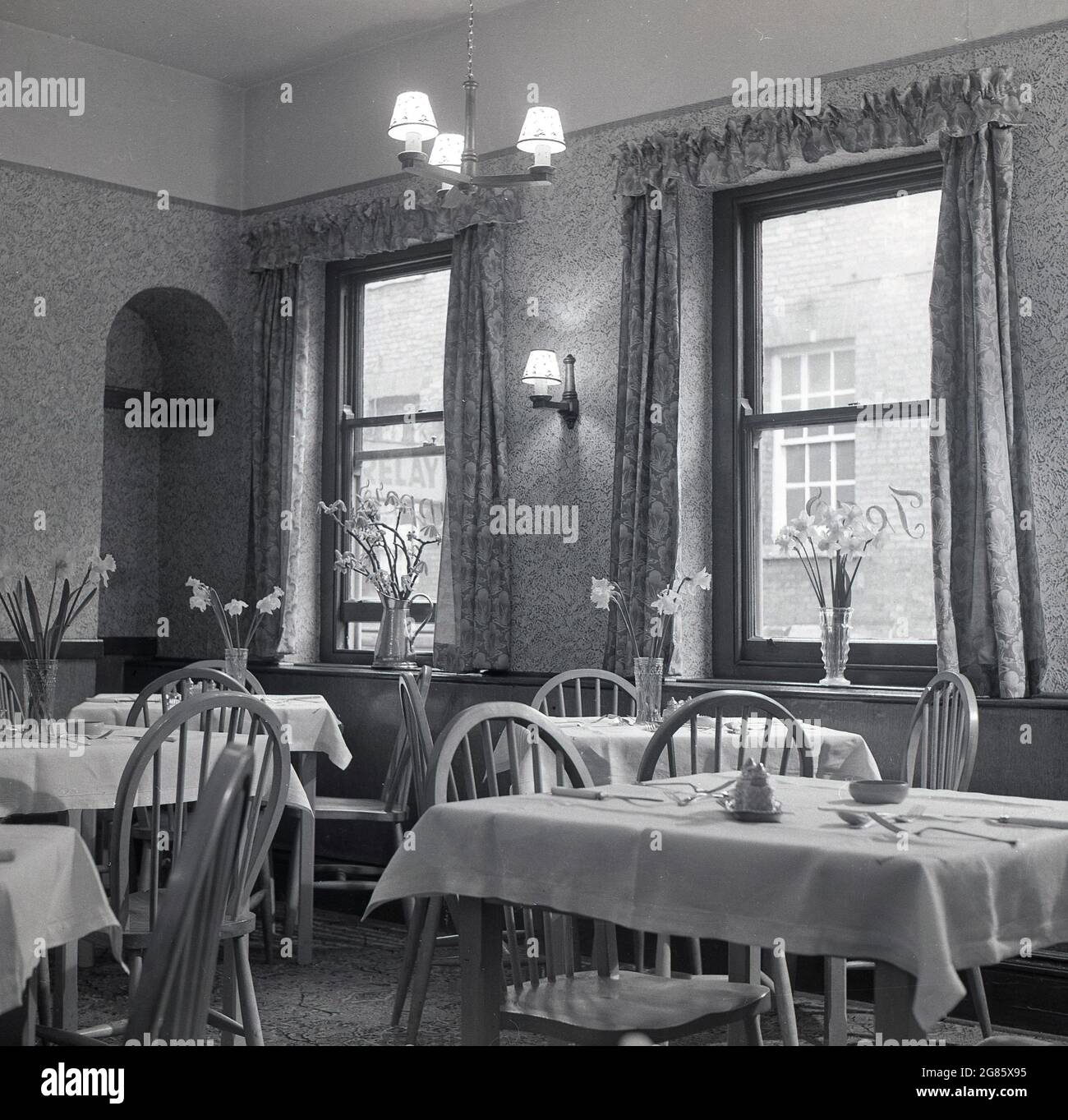 1950s, historical, empty tables inside a cafe or tea rooms of the era ...